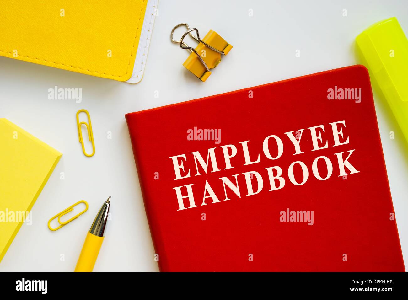 Employee handbook guide on the office desk Stock Photo - Alamy