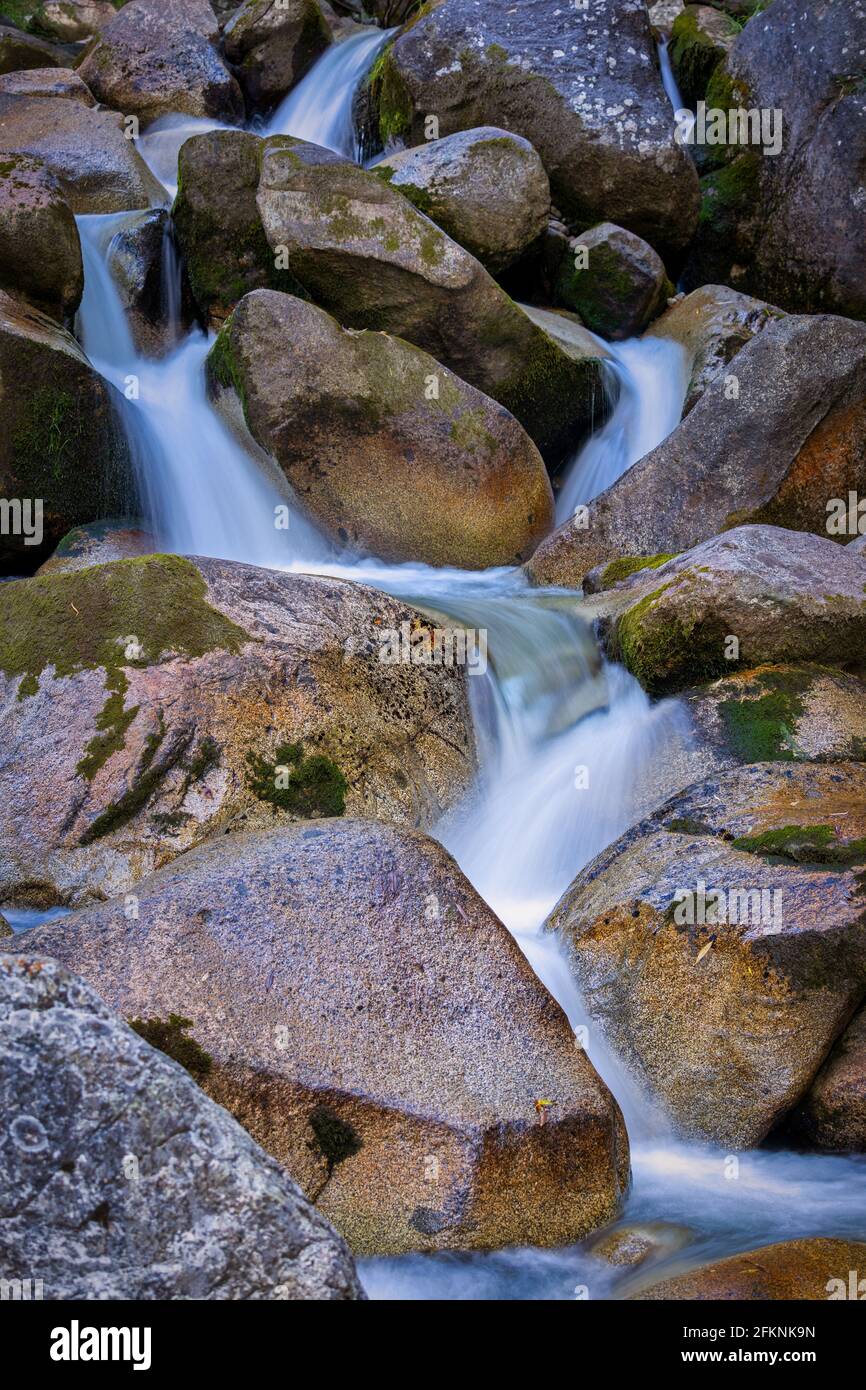 Long exposure picture from a small brock with nice rocks Stock Photo ...