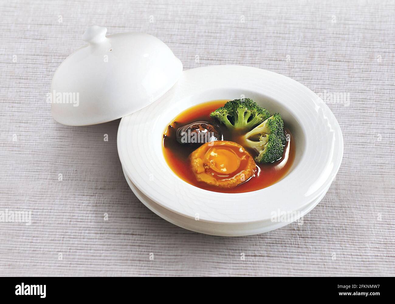 Braised abalone with broccoli and mushroom Stock Photo - Alamy
