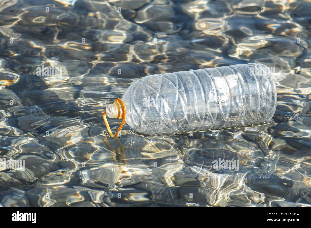 Empty plastic bottle container floating in the sea - pollution concept ...