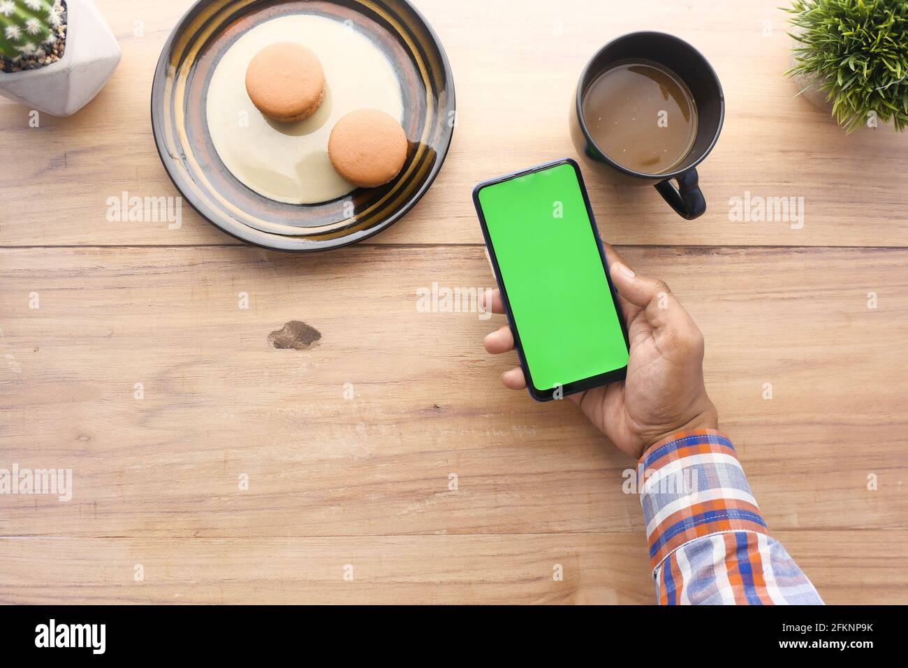 top view of man hand using smart phone on office desk Stock Photo - Alamy