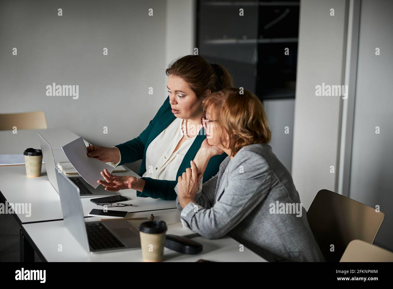 Female secretary showing boss documents hi-res stock photography and ...
