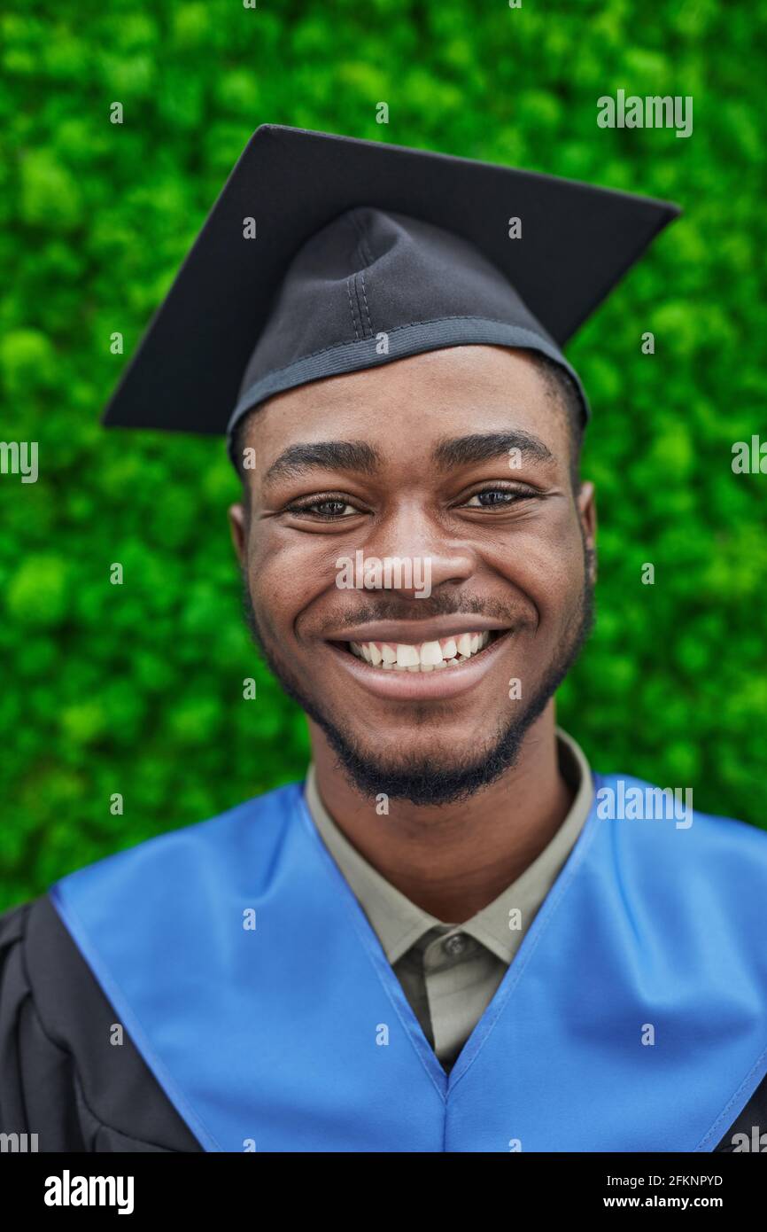 Vertical close up portrait of happy African-American man wearing ...