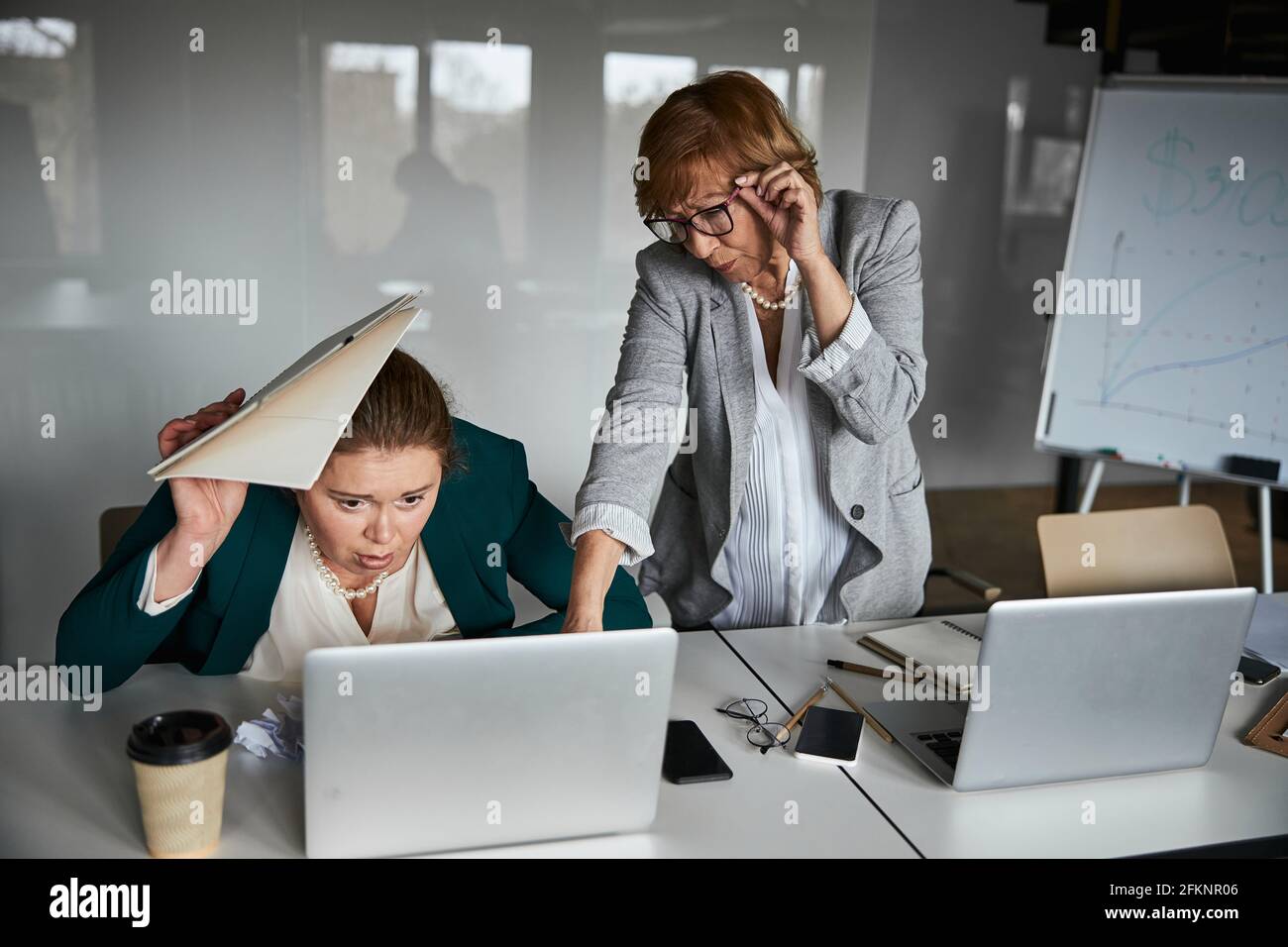 Executive manager showing a mistake to guilty subordinate Stock Photo ...