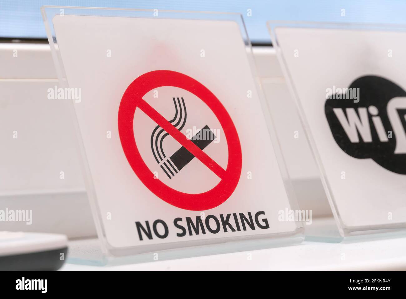 Close-up of No smoking signs and Accessible Wi-Fi in the room on the ...