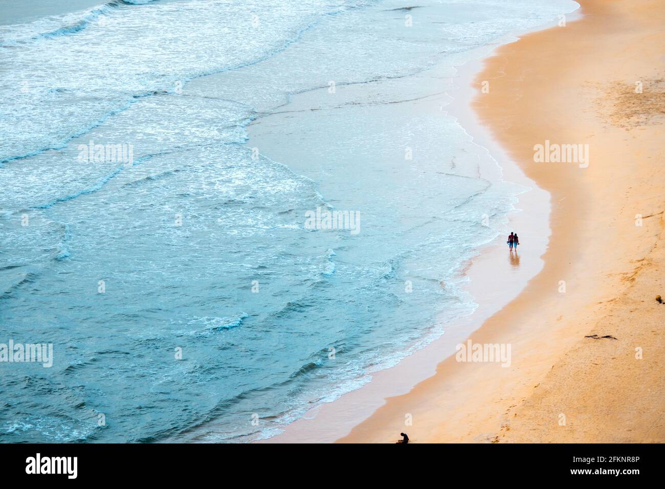 Two people walking at seashore hi-res stock photography and images - Alamy