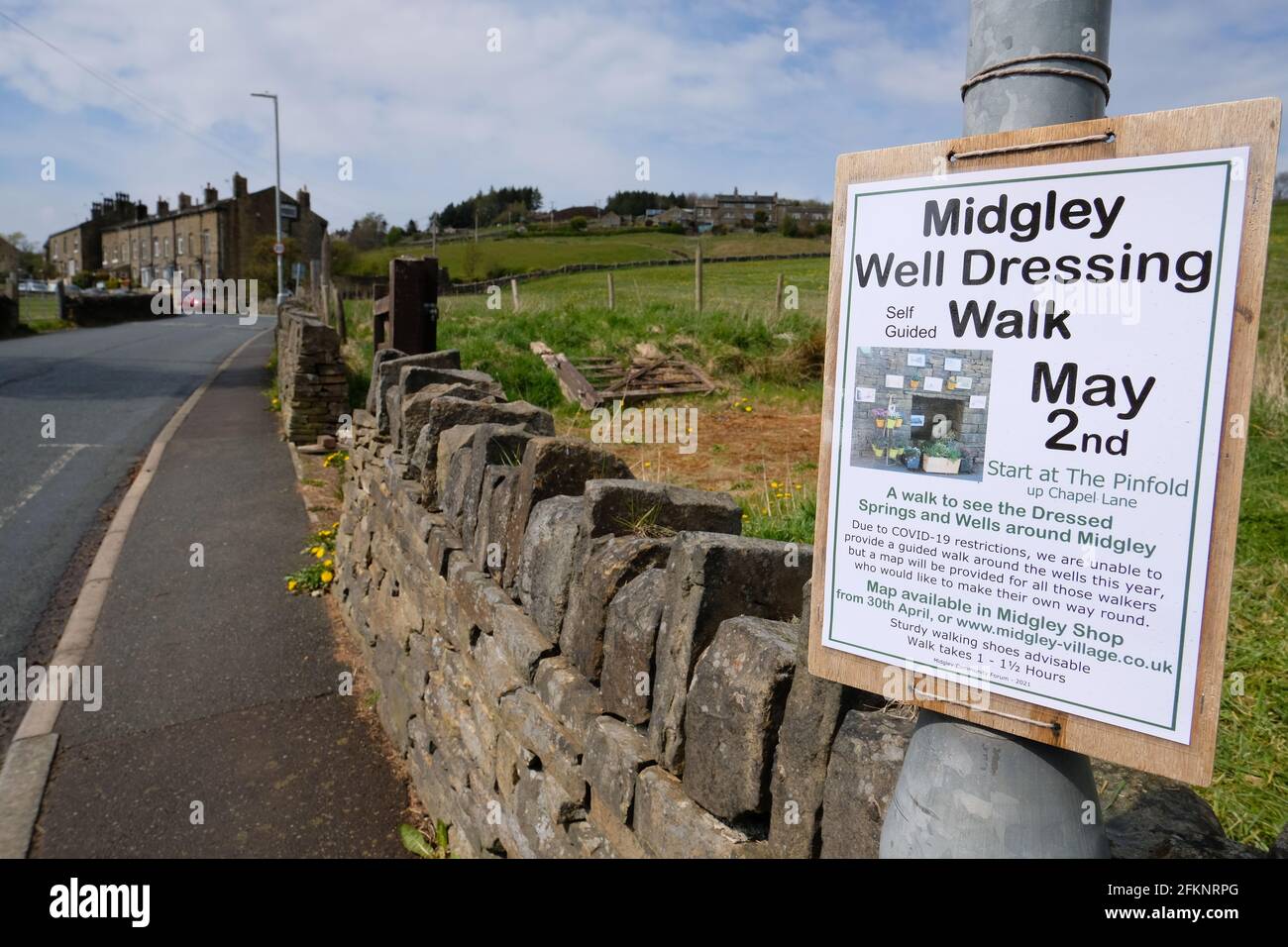 Sign for well dressing walk, Spaw Sunday, Midgley. The wells are ...
