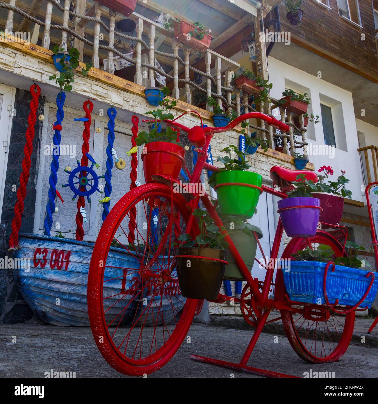 art red wheel on the street Stock Photo - Alamy