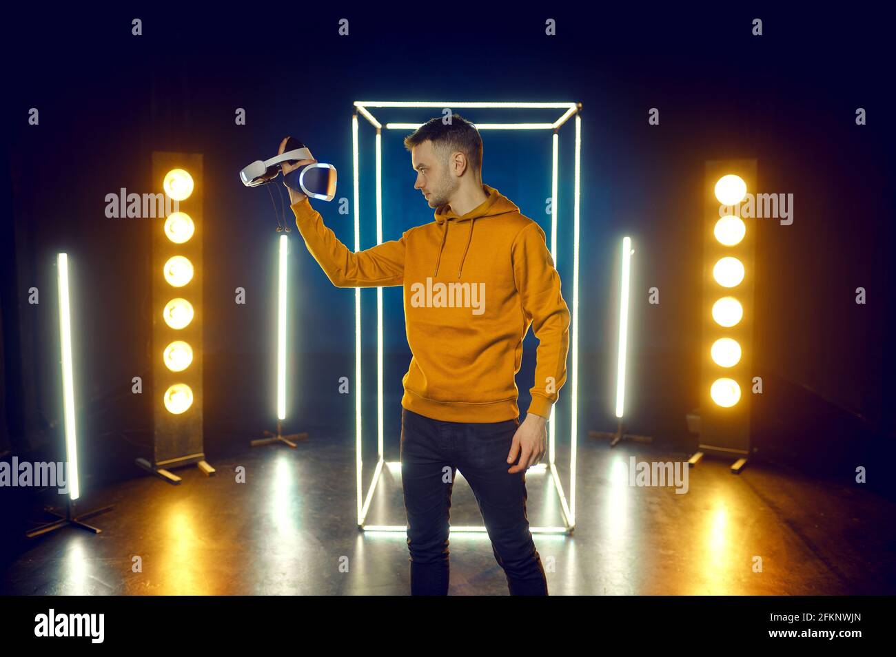 Young gamer poses with virtual reality headset Stock Photo - Alamy