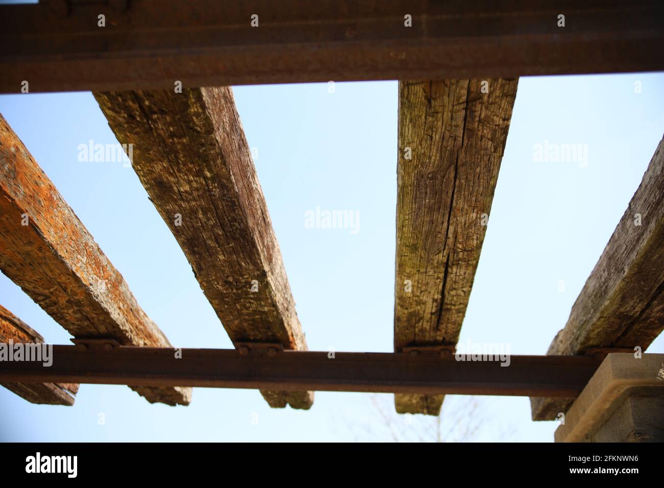 Low angle shot of the wooden planks of an unfinished building under the ...