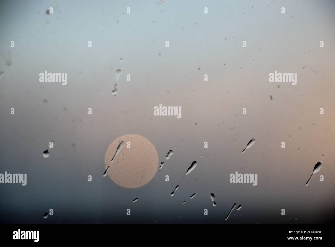 Drops of rain on window with abstract lights Stock Photo - Alamy