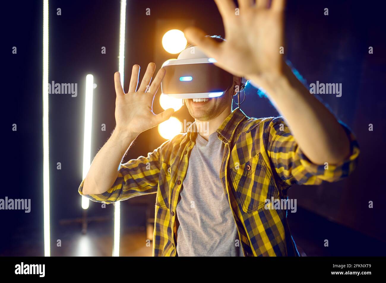 Man gaming in virtual reality headset and gamepad Stock Photo - Alamy
