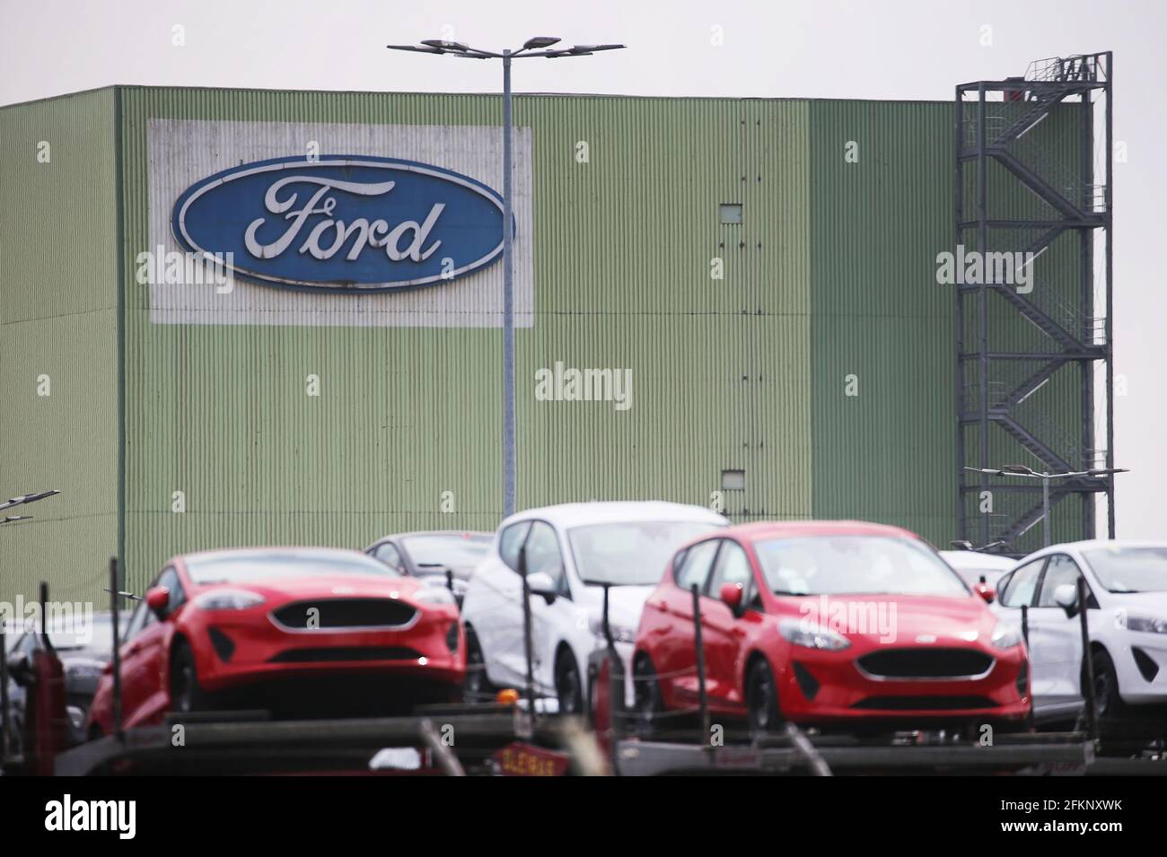 Cologne, Germany. 03rd May, 2021. Newly built cars stand on trucks in ...