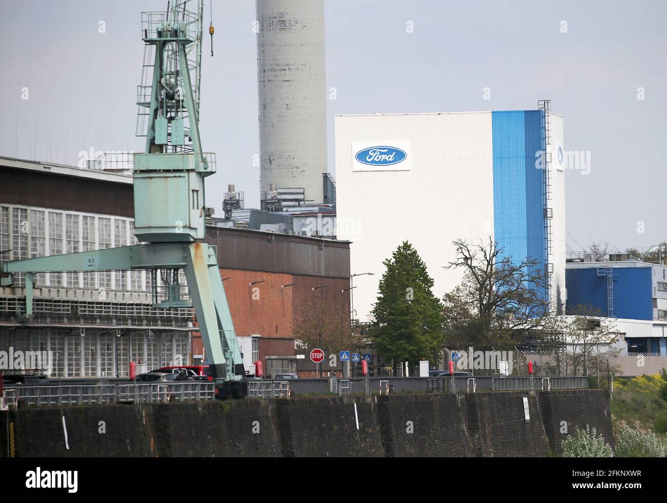 Cologne, Germany. 03rd May, 2021. A crane stands in front of the Ford ...