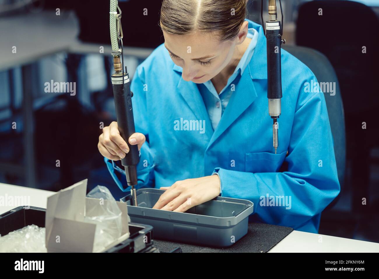 Woman electronics factory worker hi-res stock photography and images ...