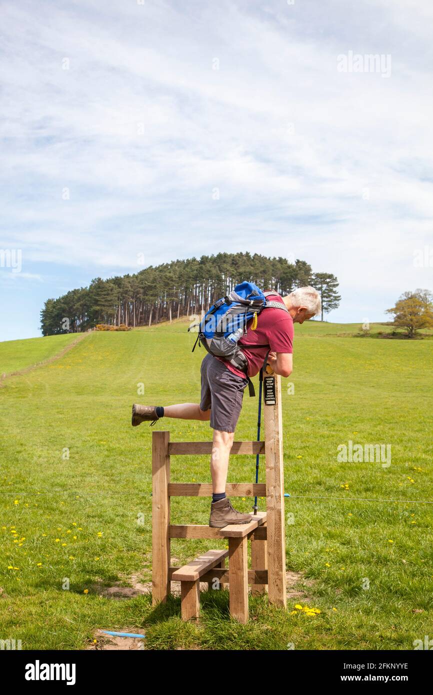 Man climbing over stile hi-res stock photography and images - Alamy