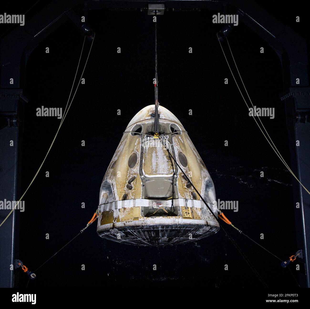 The SpaceX Crew Dragon Resilience spacecraft is lifted onto the GO ...