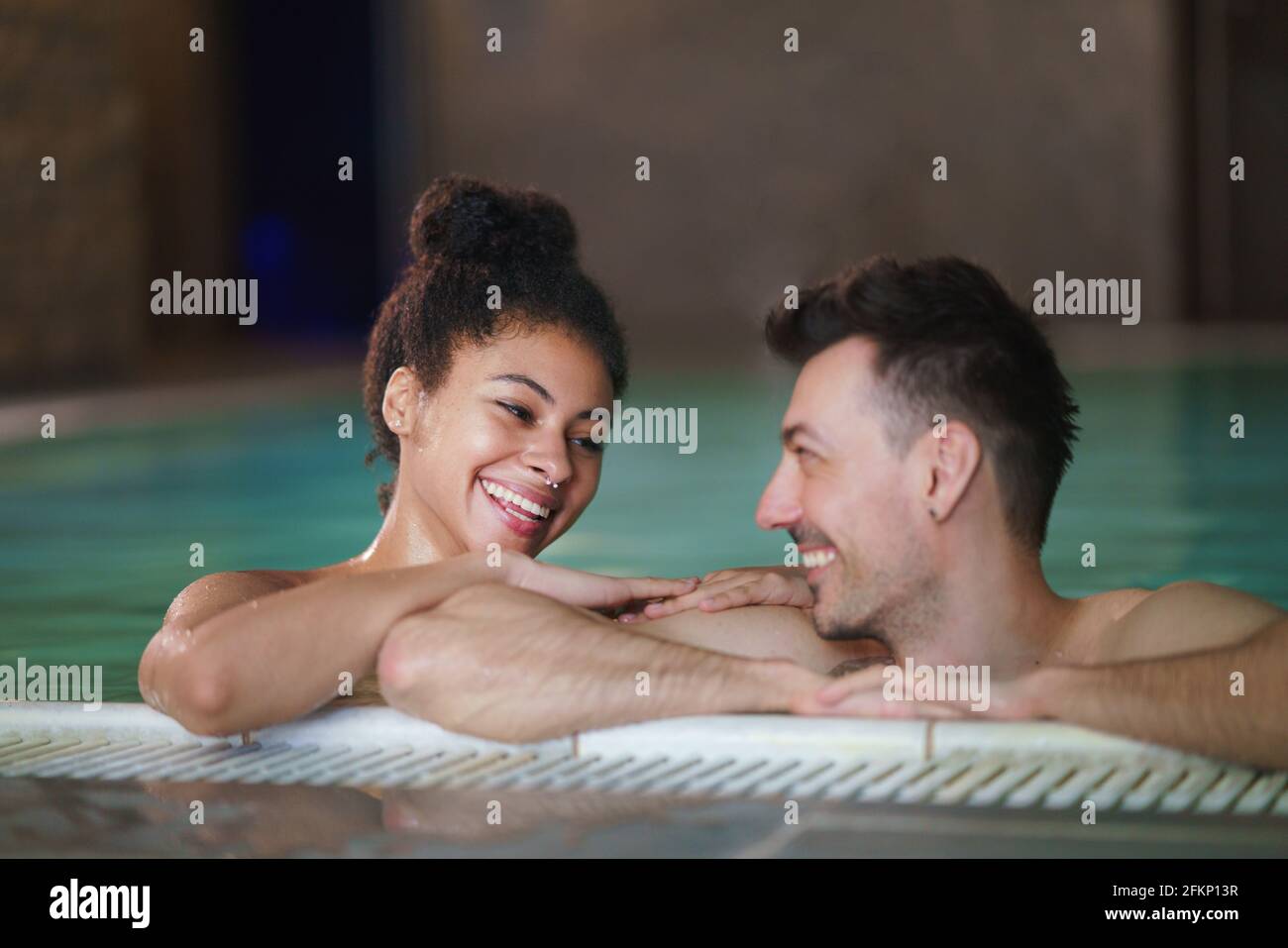 Mixed couple and swimming pool hi-res stock photography and images - Alamy