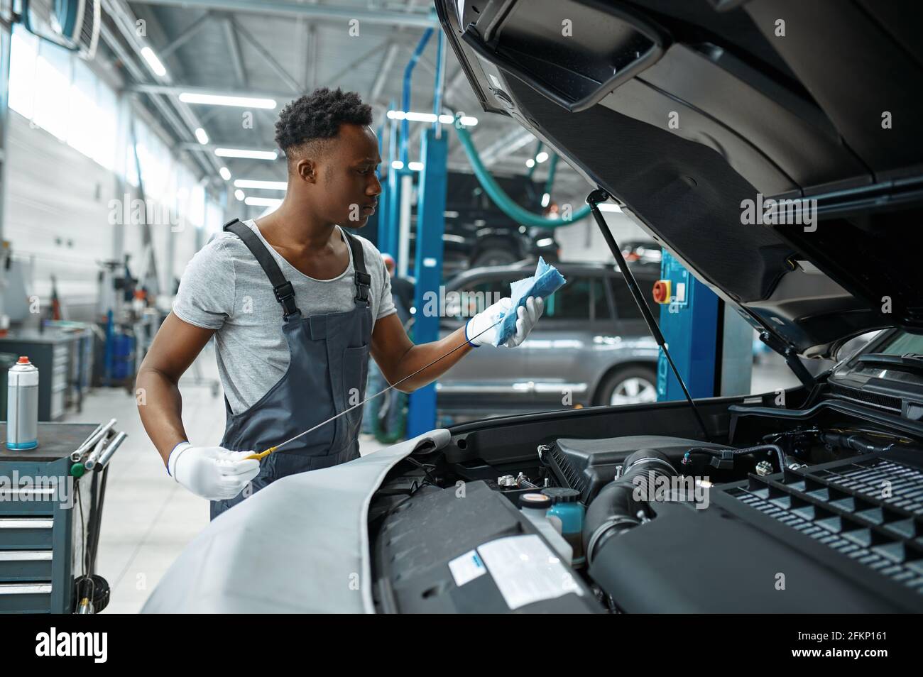 Worker checks engine oil level hi-res stock photography and images - Alamy