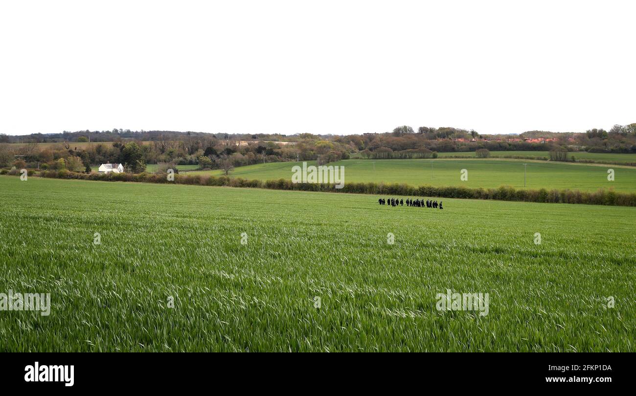 Police officers continue their search of fields close to the hamlet of ...