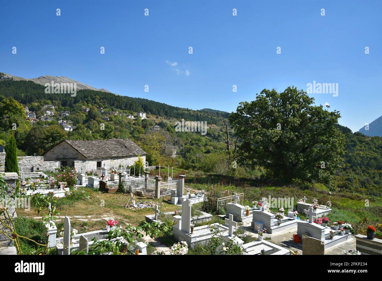 Rural traditional stone built Greek Orthodox church and cemetery in the ...