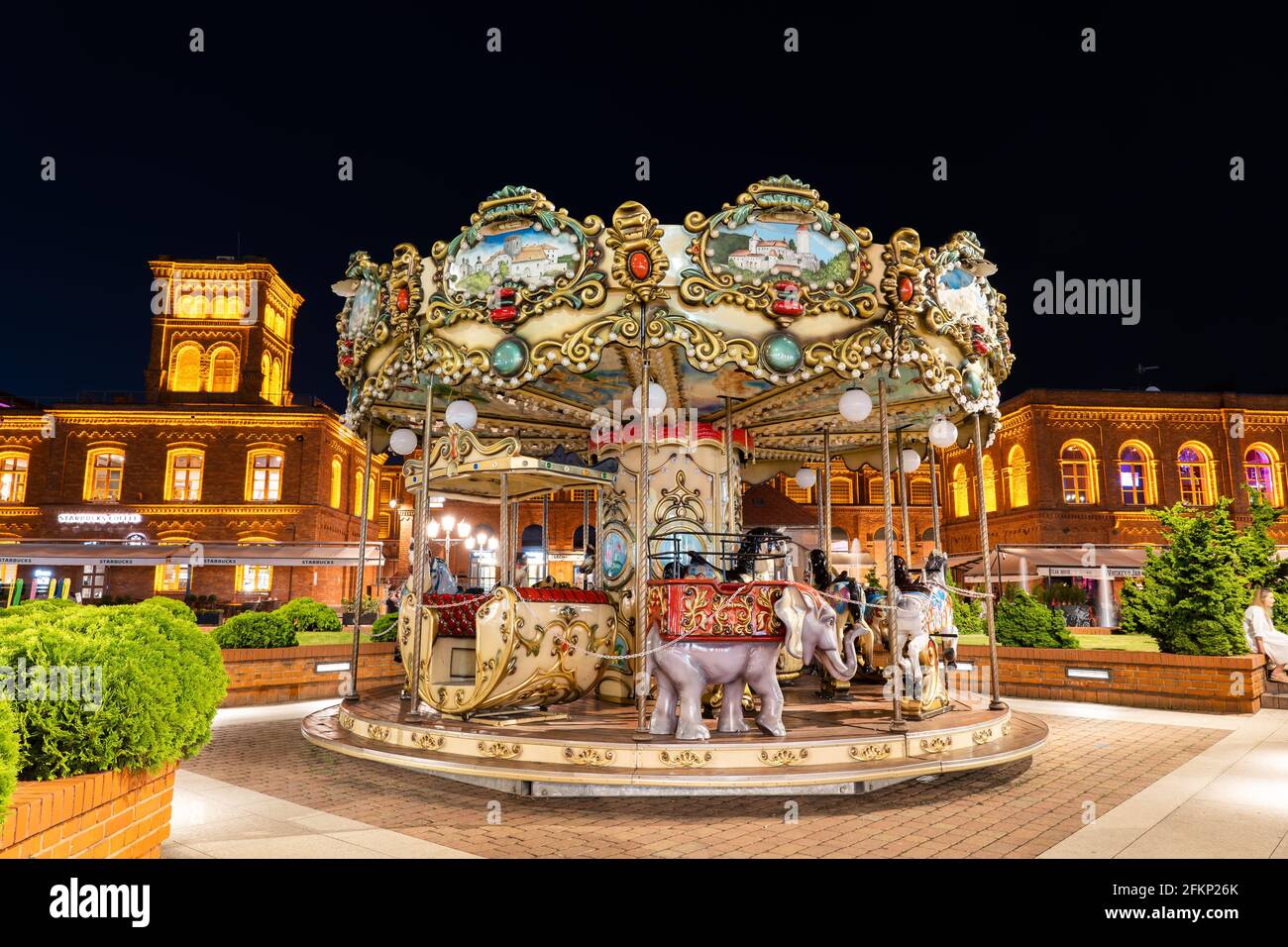 Viennese style ornamental carousel by night at Manufaktura (arts centre ...