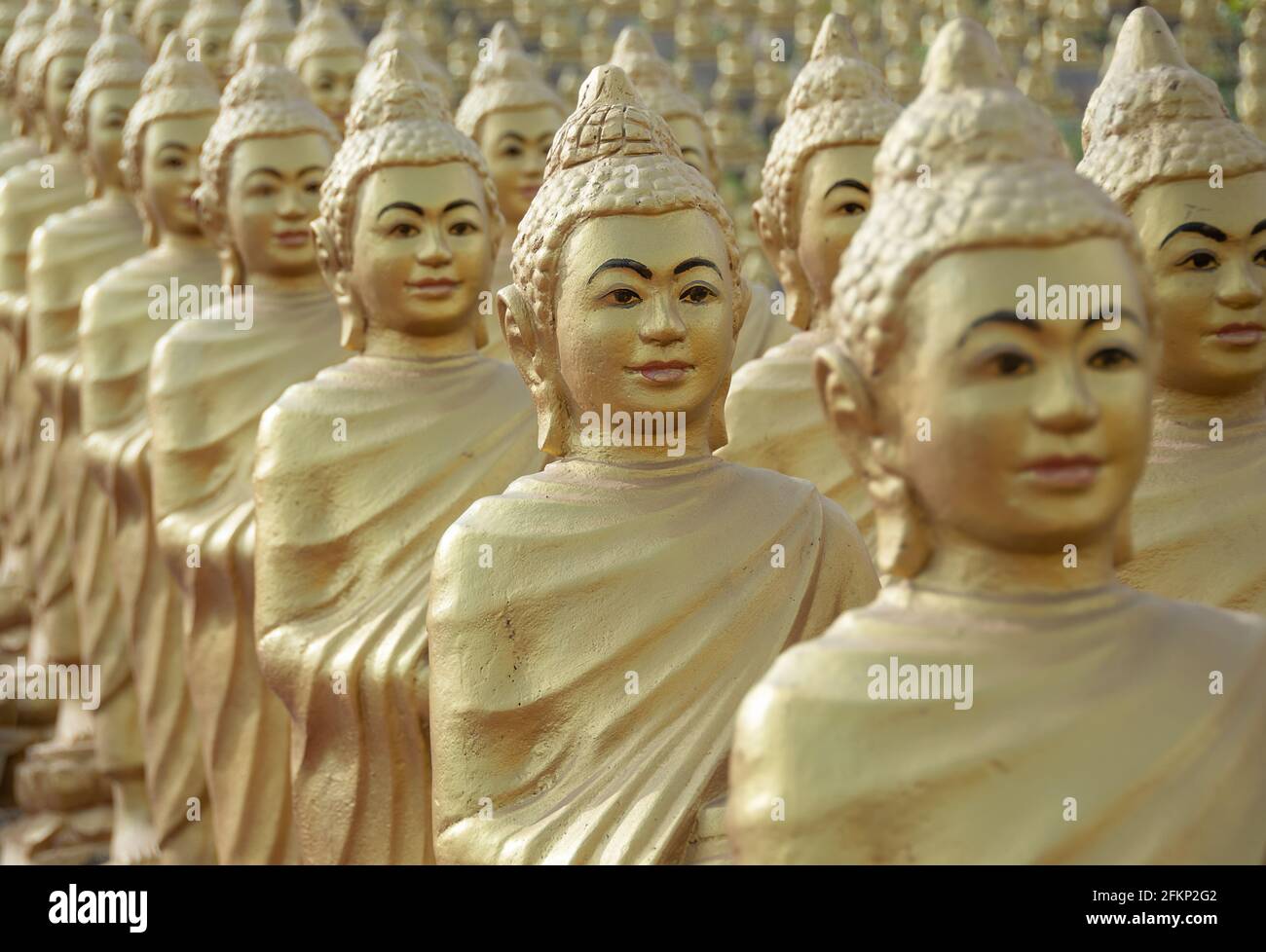 Rows of standing statue in Cambodia Stock Photo - Alamy
