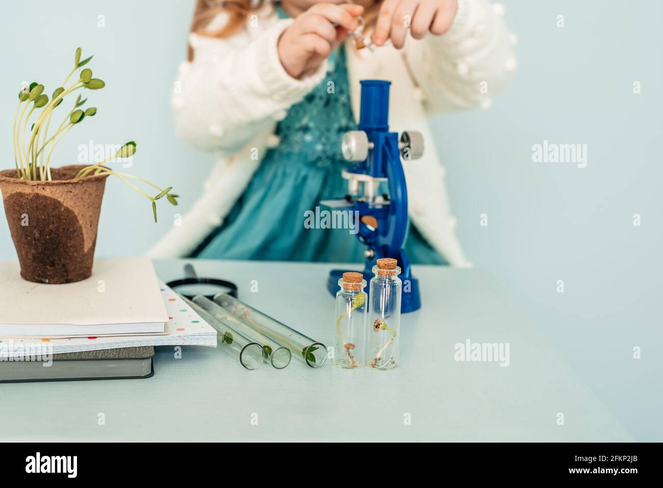 education concept. Little baby Girl look at microscopes in the ...