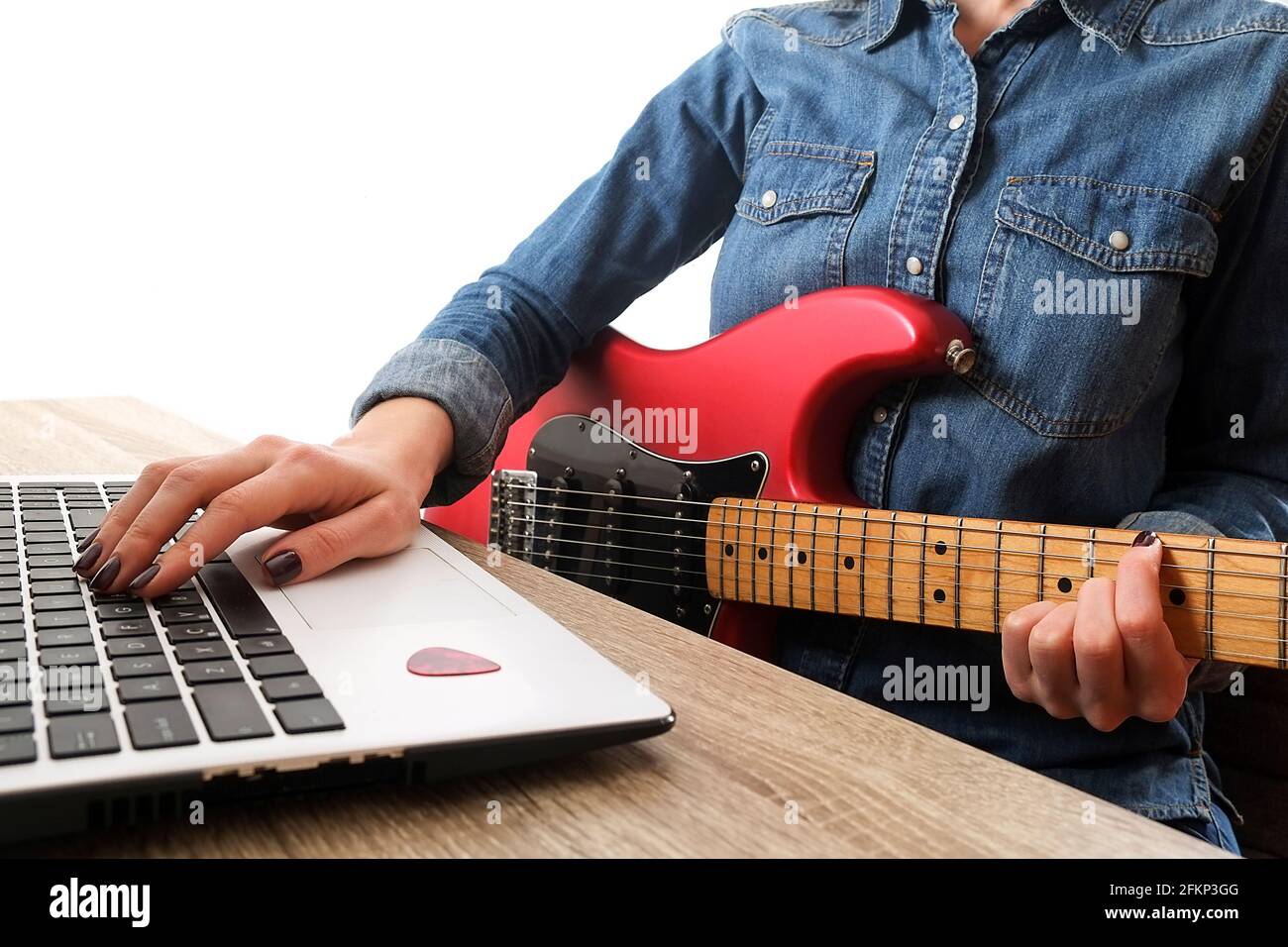 Female hipster music college student practicing electric guitar ...