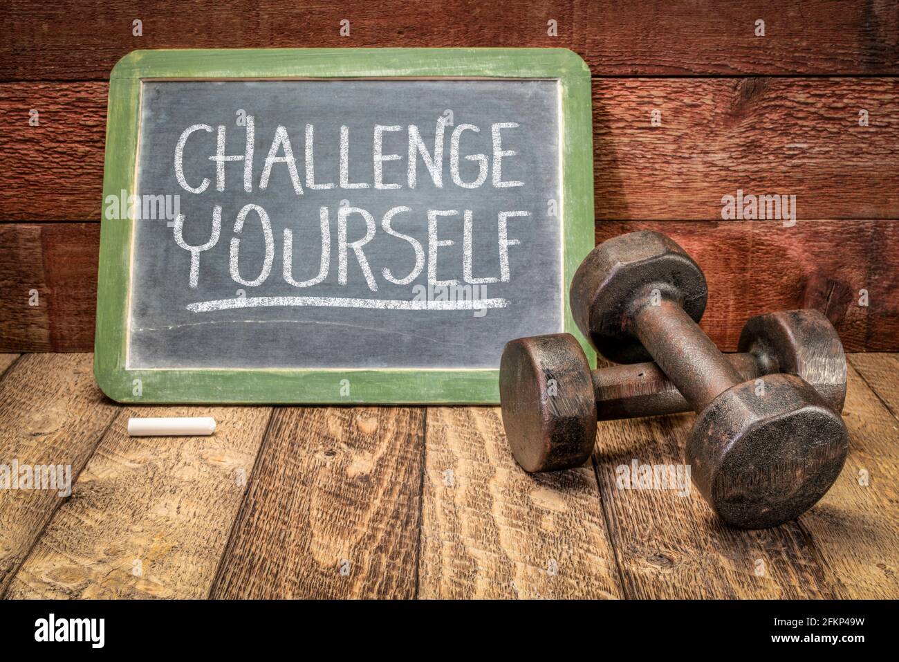 challenge yourself motivational concept, white chalk writing on a slate ...