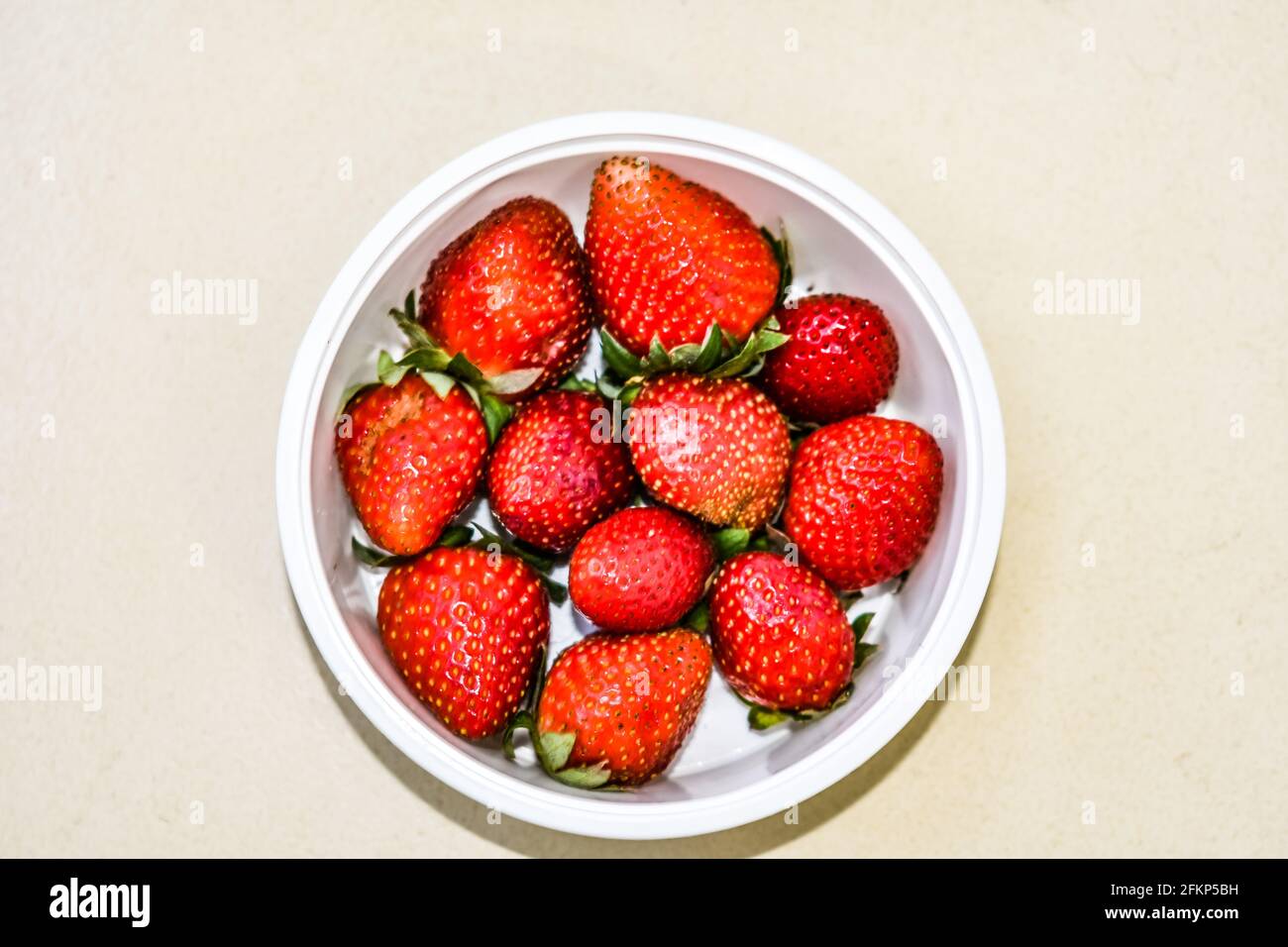 Indian sweet red strawberry packing container in garden looking awesome ...