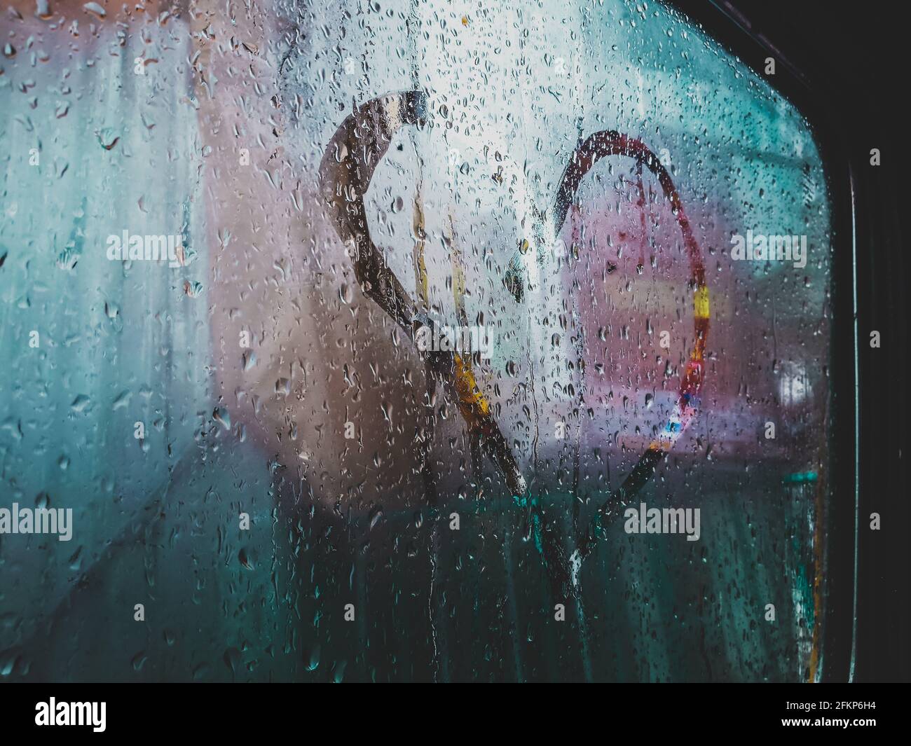 Closeup shot of a heart drawn on the steamed glass with raindrops Stock ...