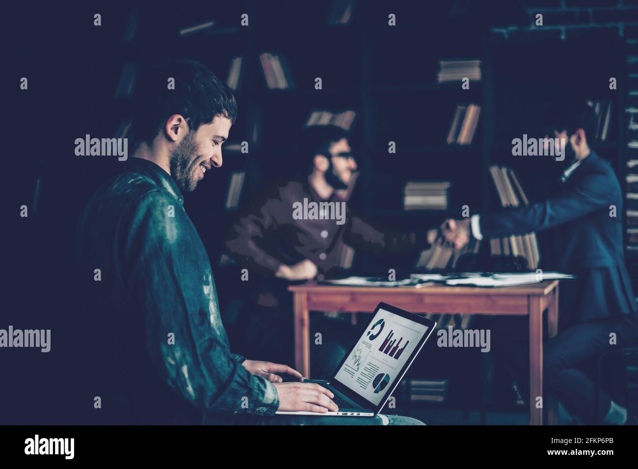 sales Manager working on laptop with a marketing report Stock Photo - Alamy