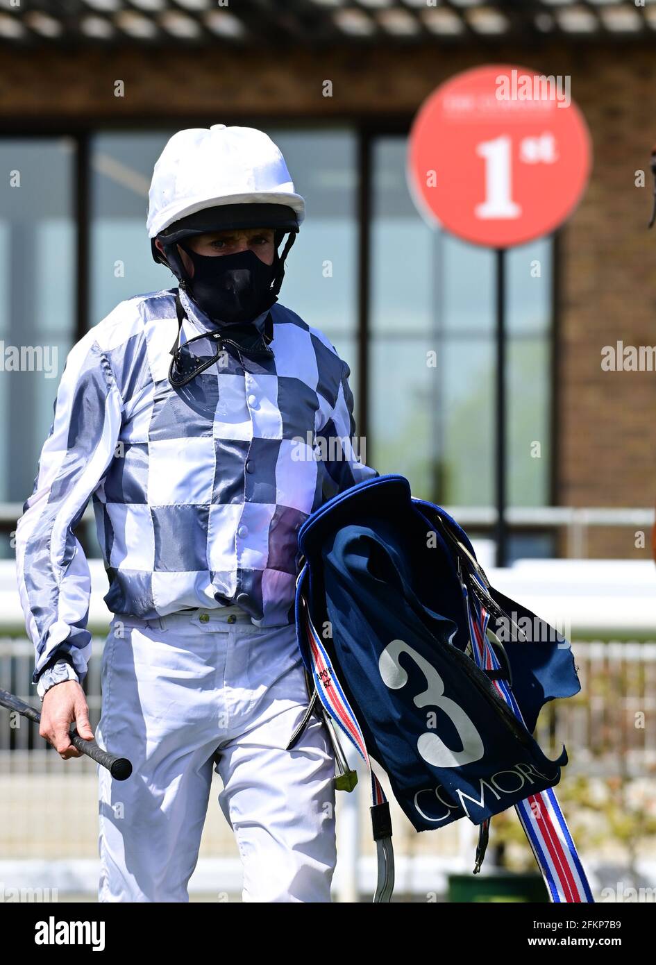 Jockey Ryan Moore (left) celebrates winning the Coolmore Scottsass ...