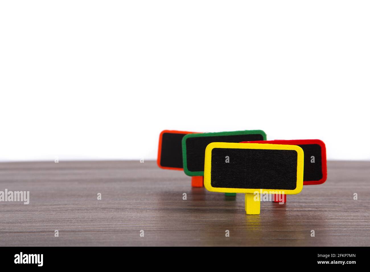 A blank wooden tag on table with white background Stock Photo - Alamy