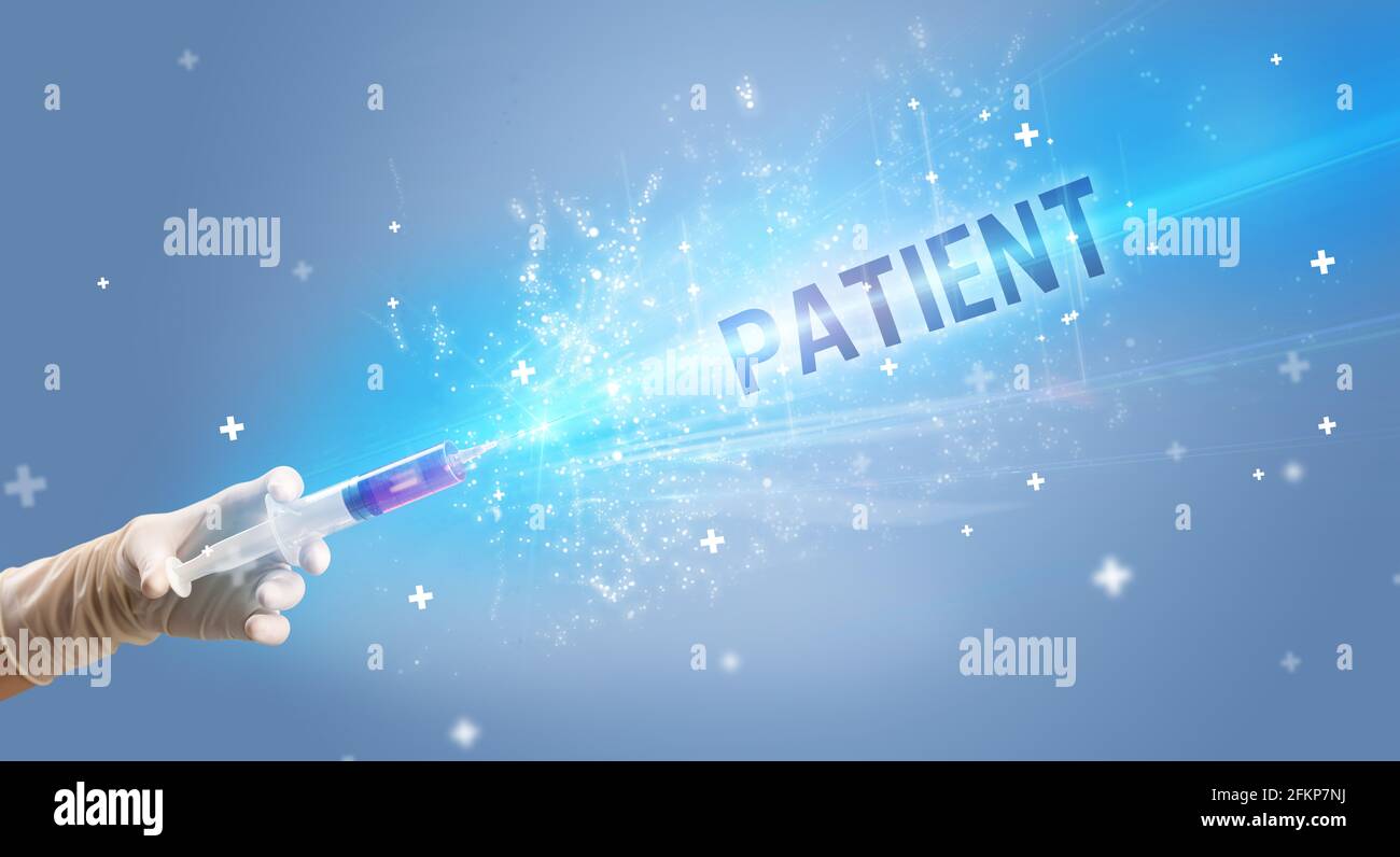 Syringe, medical injection in hand Stock Photo - Alamy