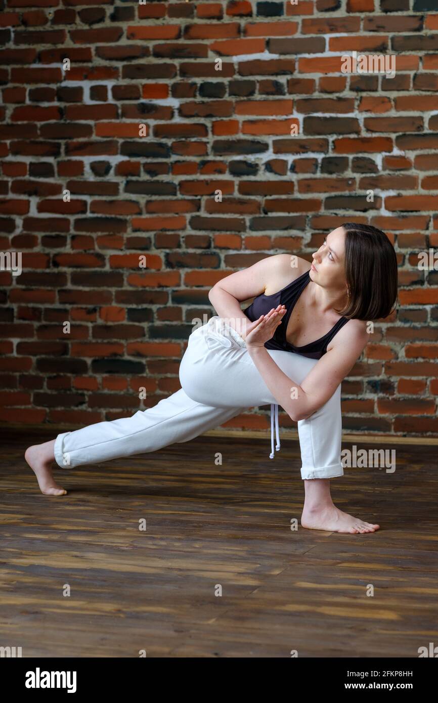 Athlete woman practicing yoga Stock Photo - Alamy