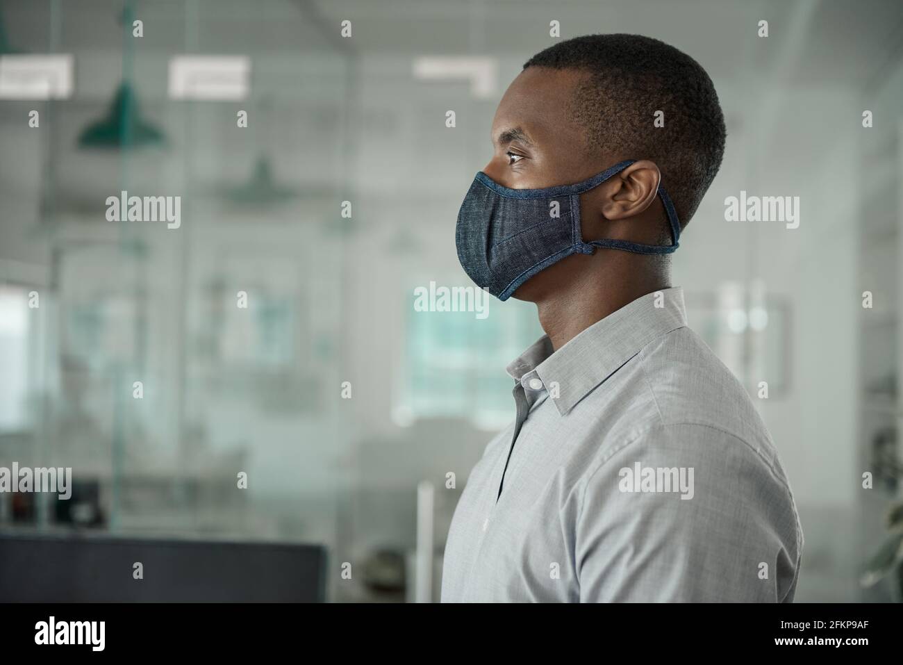 Side view young black businessman hi-res stock photography and images ...