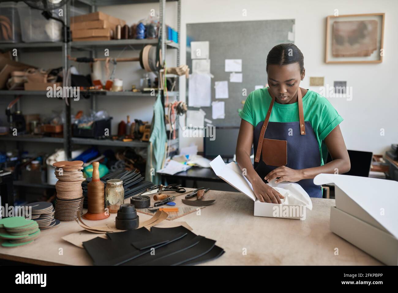 Young woman packing orders hi-res stock photography and images - Alamy