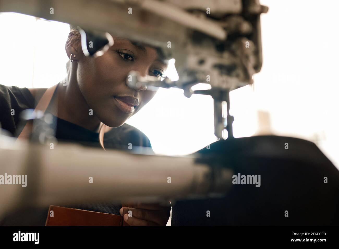 Young african textile sewing on hi-res stock photography and images - Alamy