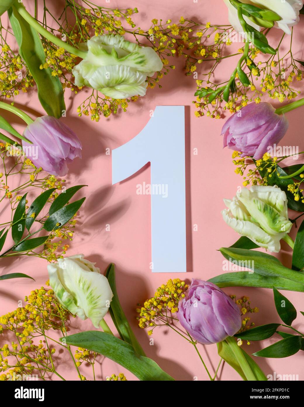 Number one on pink background with colorful flowers. Flat lay, top view ...