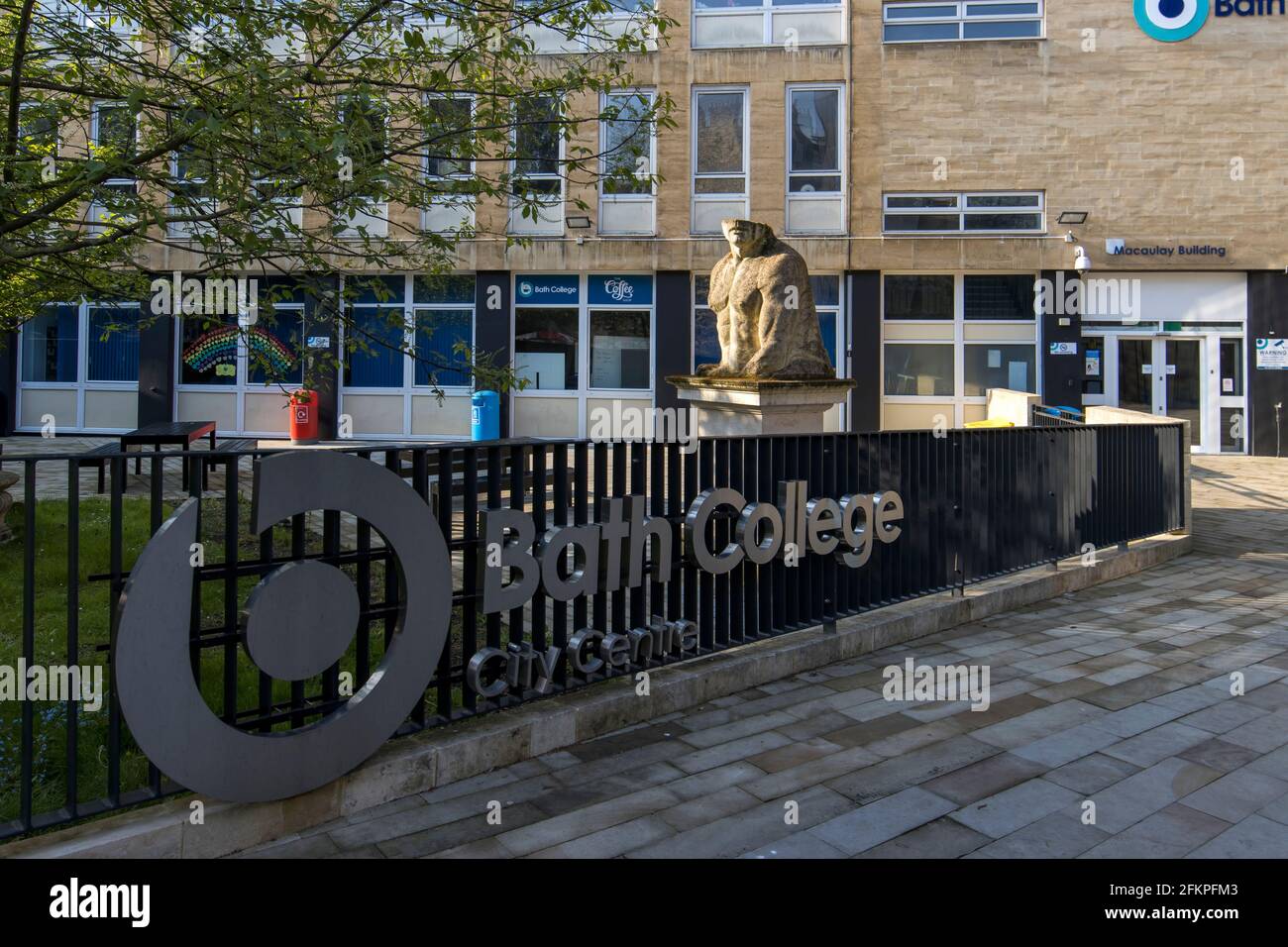 A view of the entrance to Bath College, with a stone statue of Olympic ...