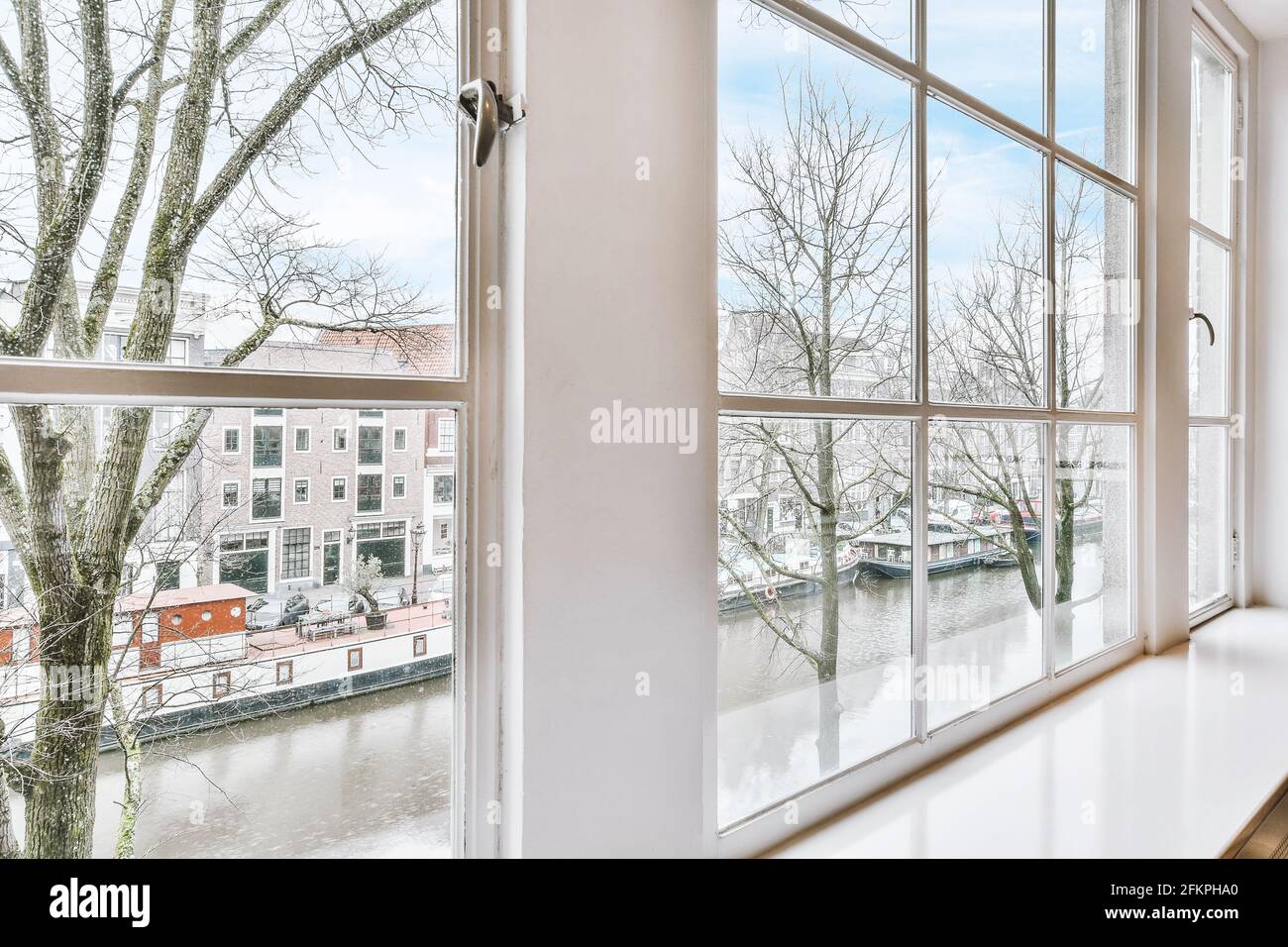 River behind window of modern apartment Stock Photo - Alamy