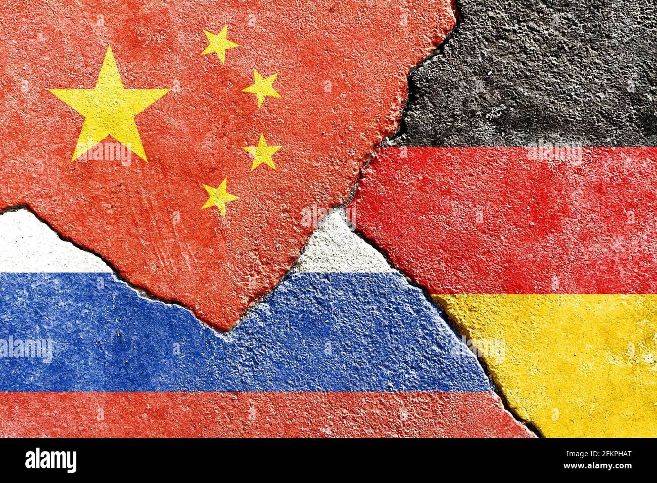 China VS Germany VS Russia flags on cracked wall background ...