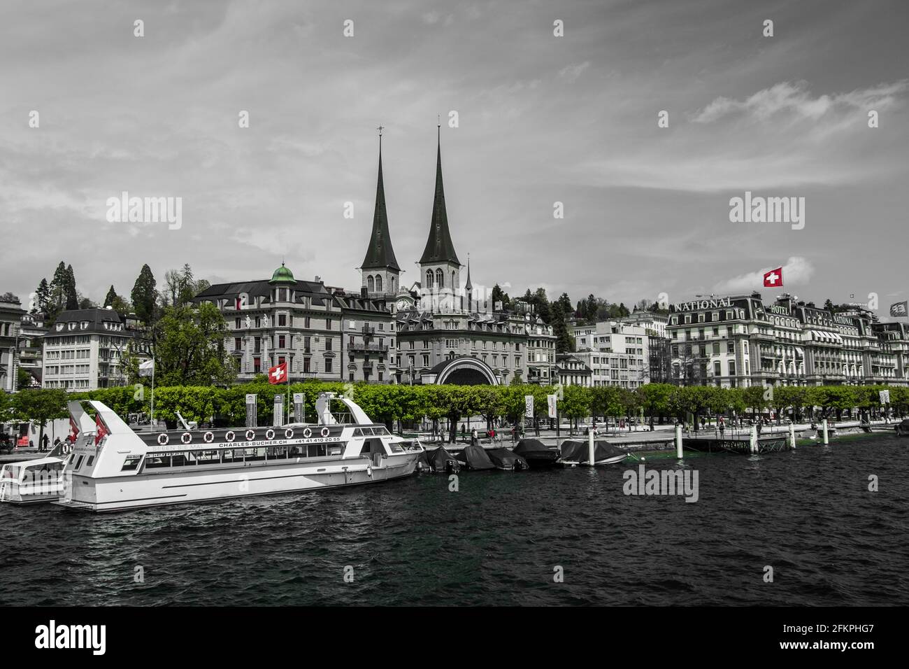 Landscape view of the lake and old town of Luzern with touristic boats ...