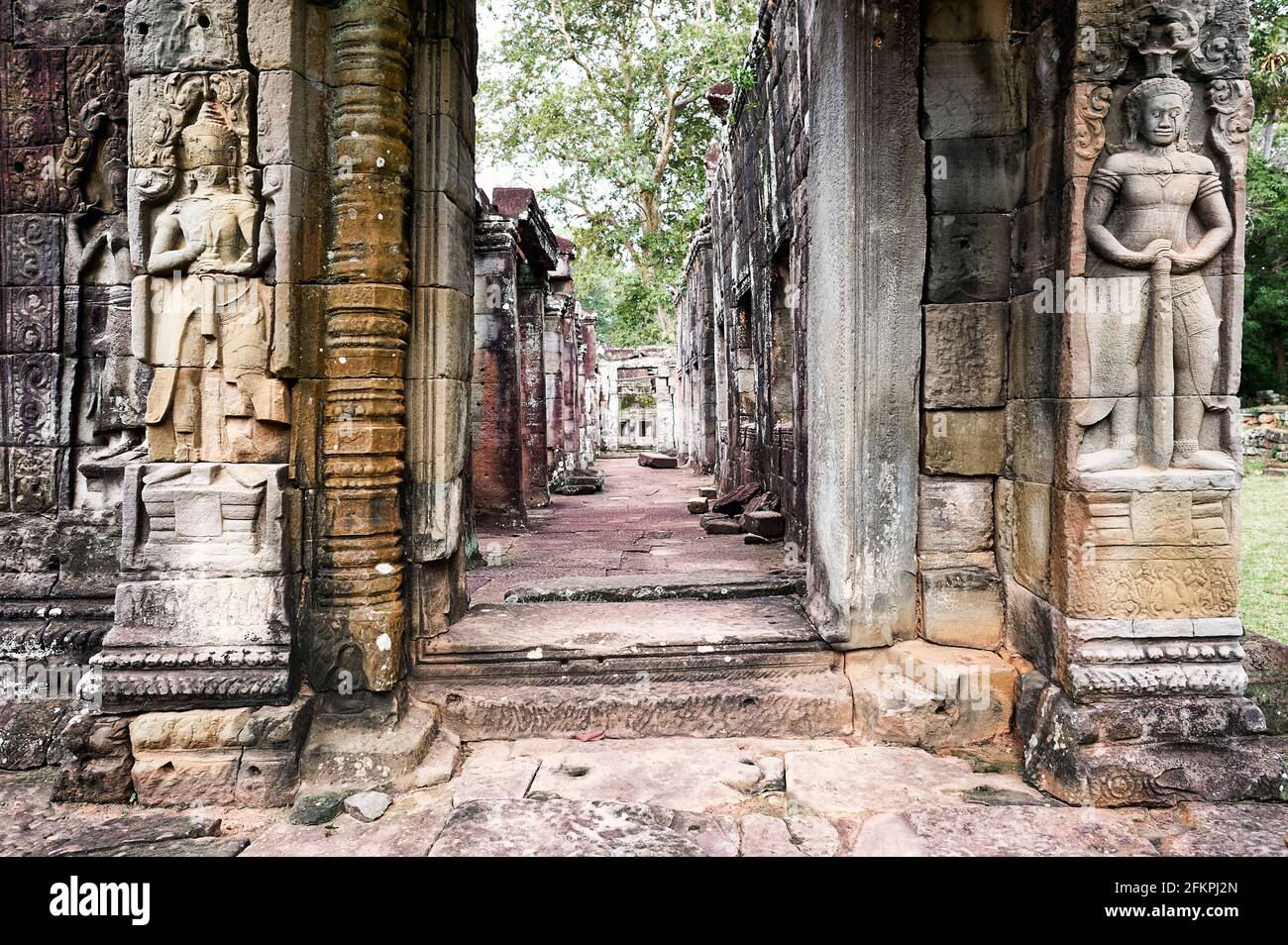 Statues at the entrance of the jungle temples of Ta Prohm. Siem Reap ...