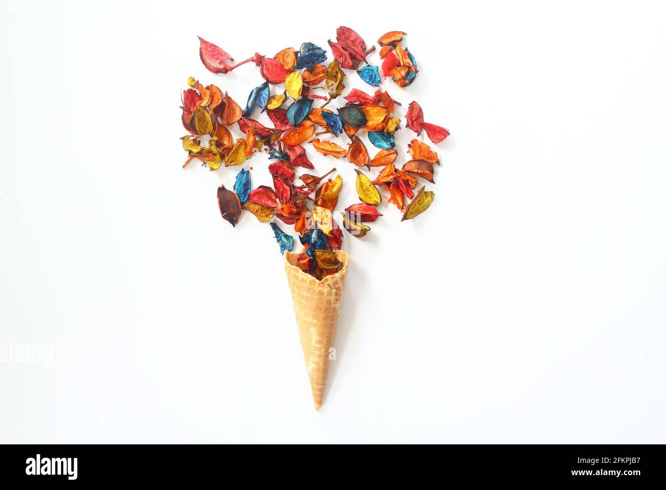 Top view of ice cream cone with colorful flower on the white background ...