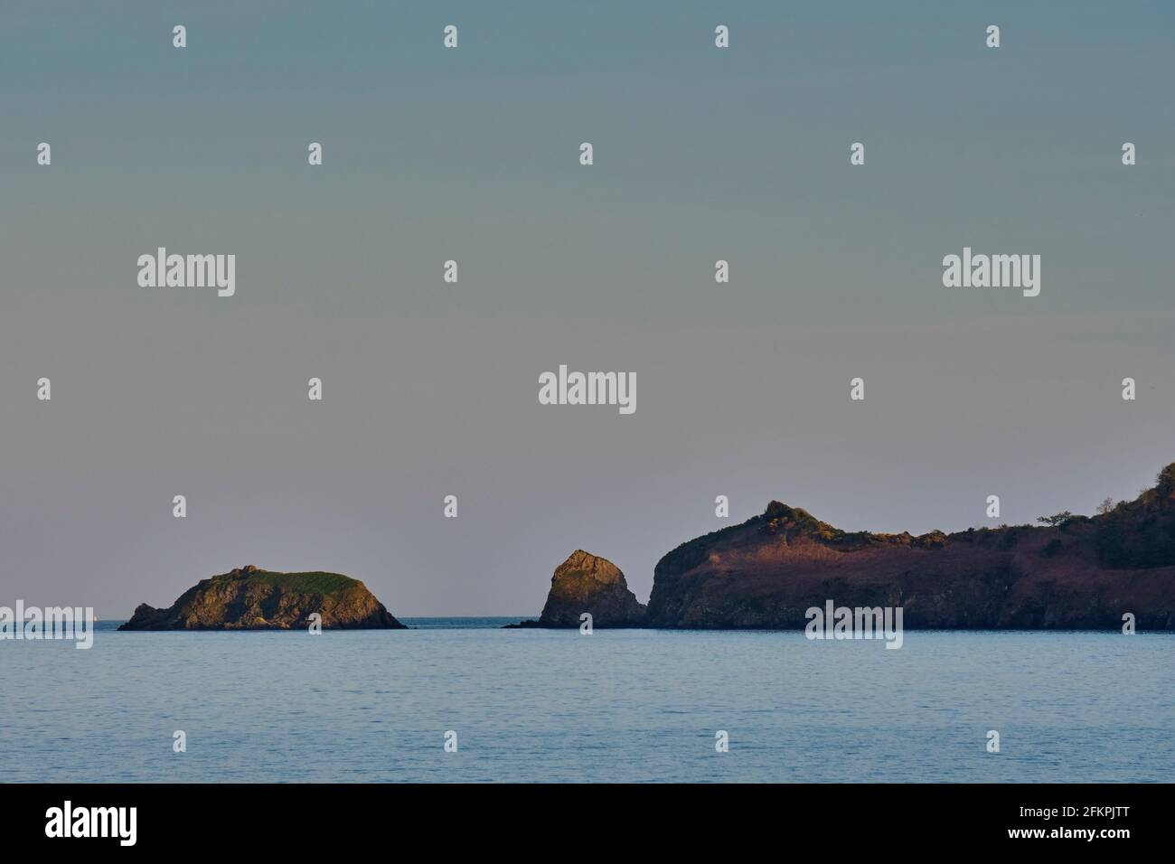 Evening sunlight on Monkstone Point, seen from Saundersfoot Harbour ...