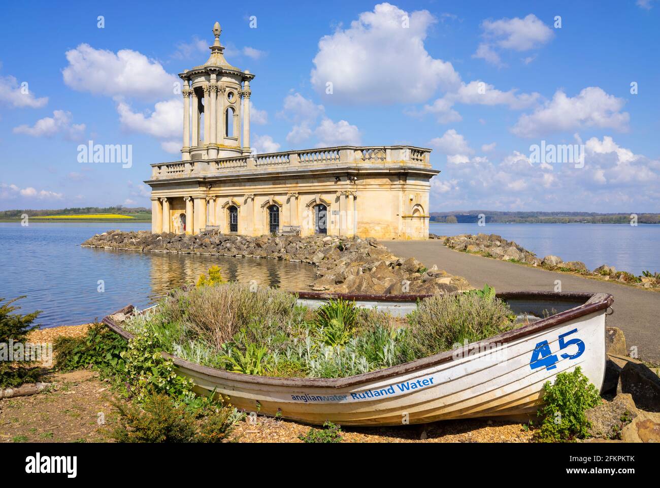 Rutland water church with small boat, Normanton Church at Rutland Water ...