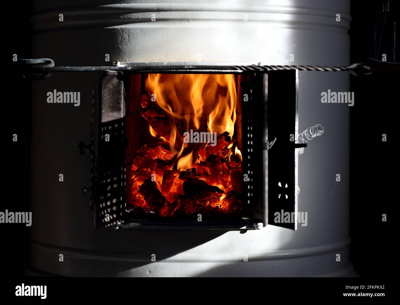 An open fireplace with high flames Stock Photo - Alamy